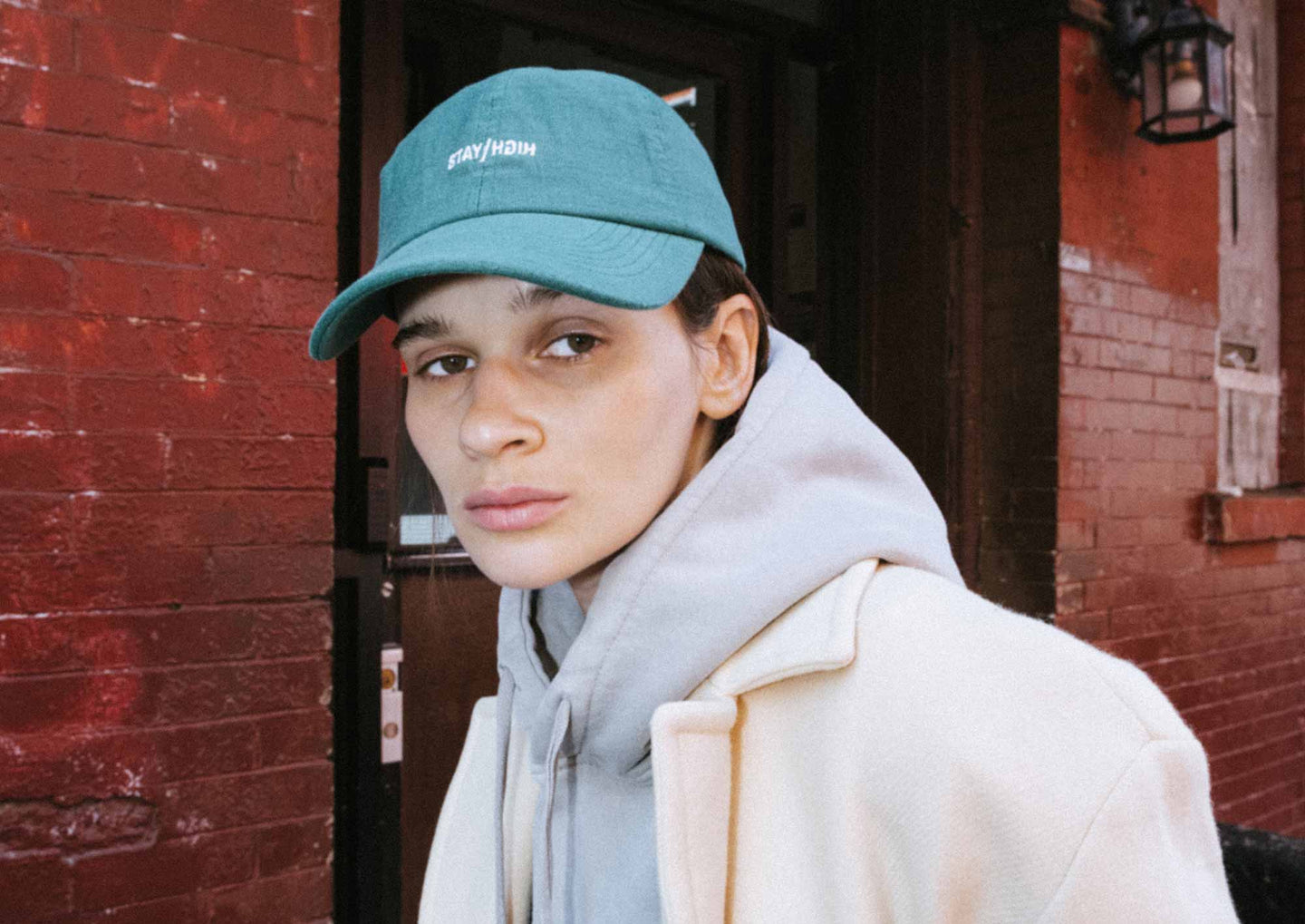 Stiksen | Why do baseball caps have a small button on top?